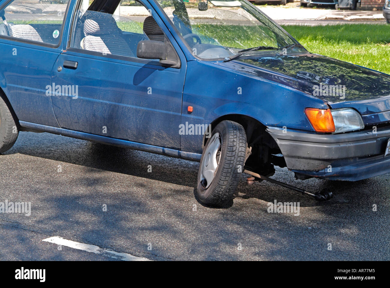 Collapsed suspension on car Stock Photo - Alamy