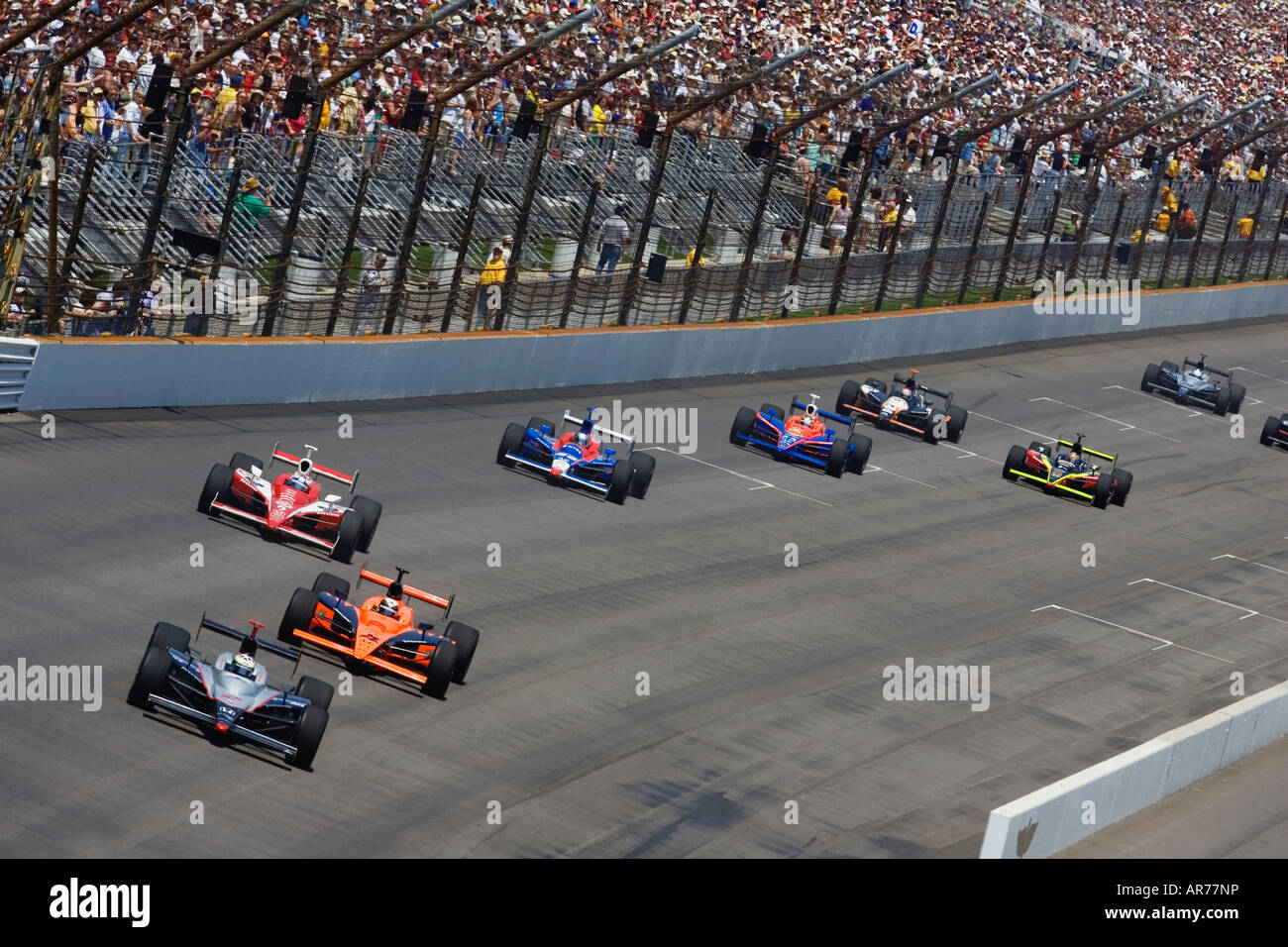 Indy cars on the front straightaway early in the 90th Indianapolis 500 ...