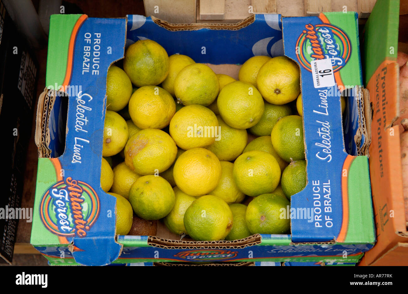 Limes from Brazil in box in Bristol market England UK EU Stock Photo ...