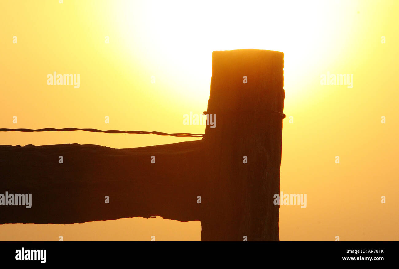 Fence post sun Stock Photo - Alamy