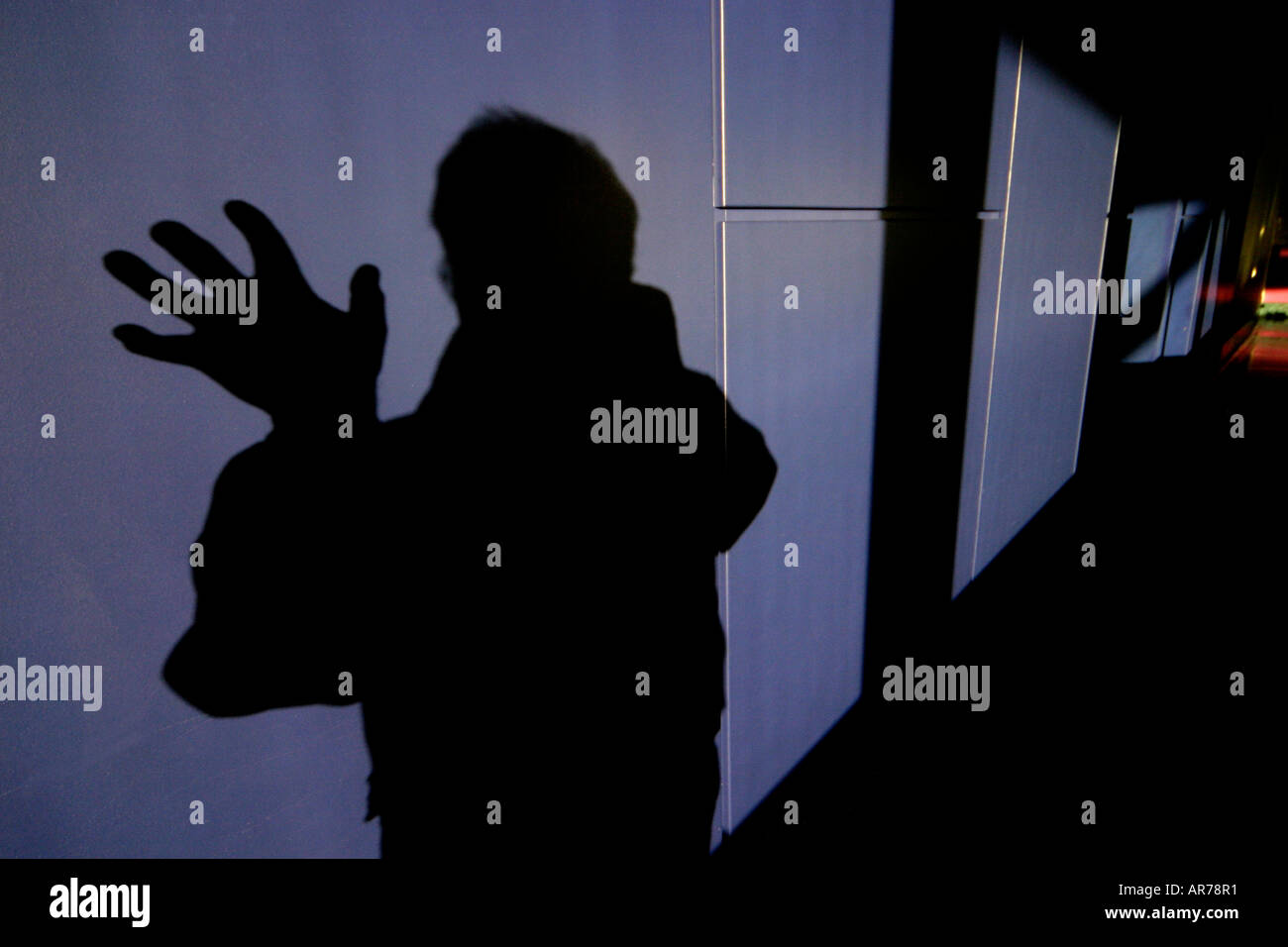 Shadowy figure corridor hi-res stock photography and images - Alamy