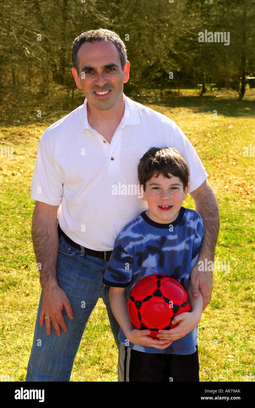 Portrait of father and son playing outdoors Stock Photo - Alamy Portrait of father and son playing outdoors Stock Photo - Alamy