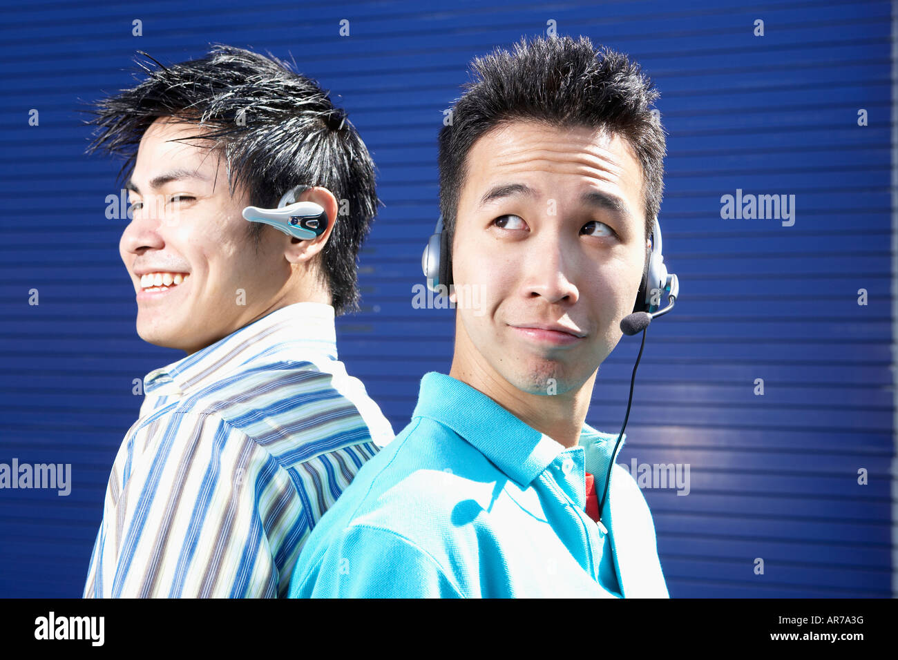 Two business people wearing headsets hi-res stock photography and ...