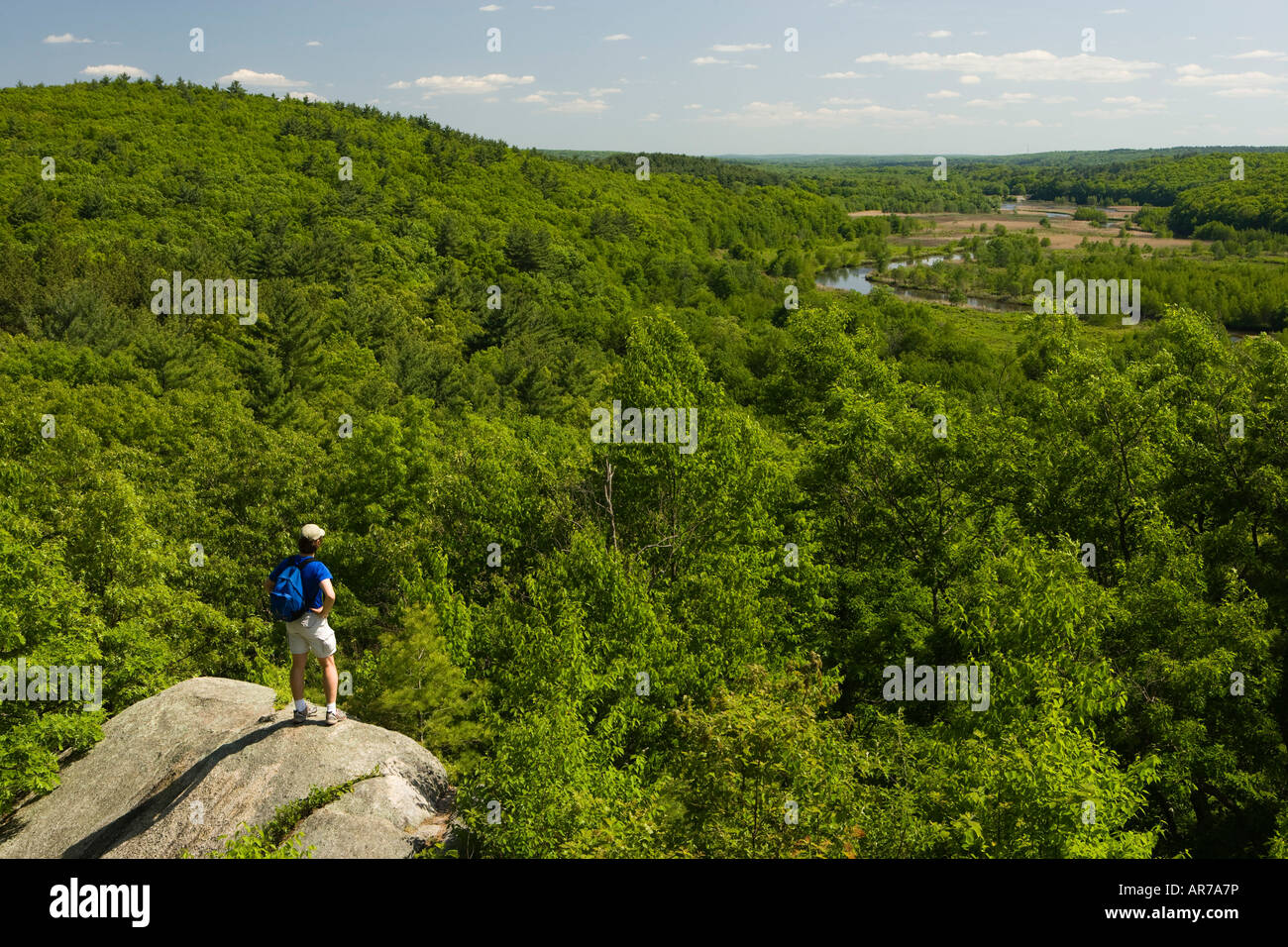 A hiker on Lookout Rock in Blackstone River and Canal Heritage State ...