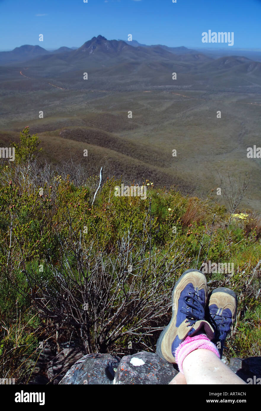 Hiker's feet on the summit of Mt Magog looking west at the Stirling ...