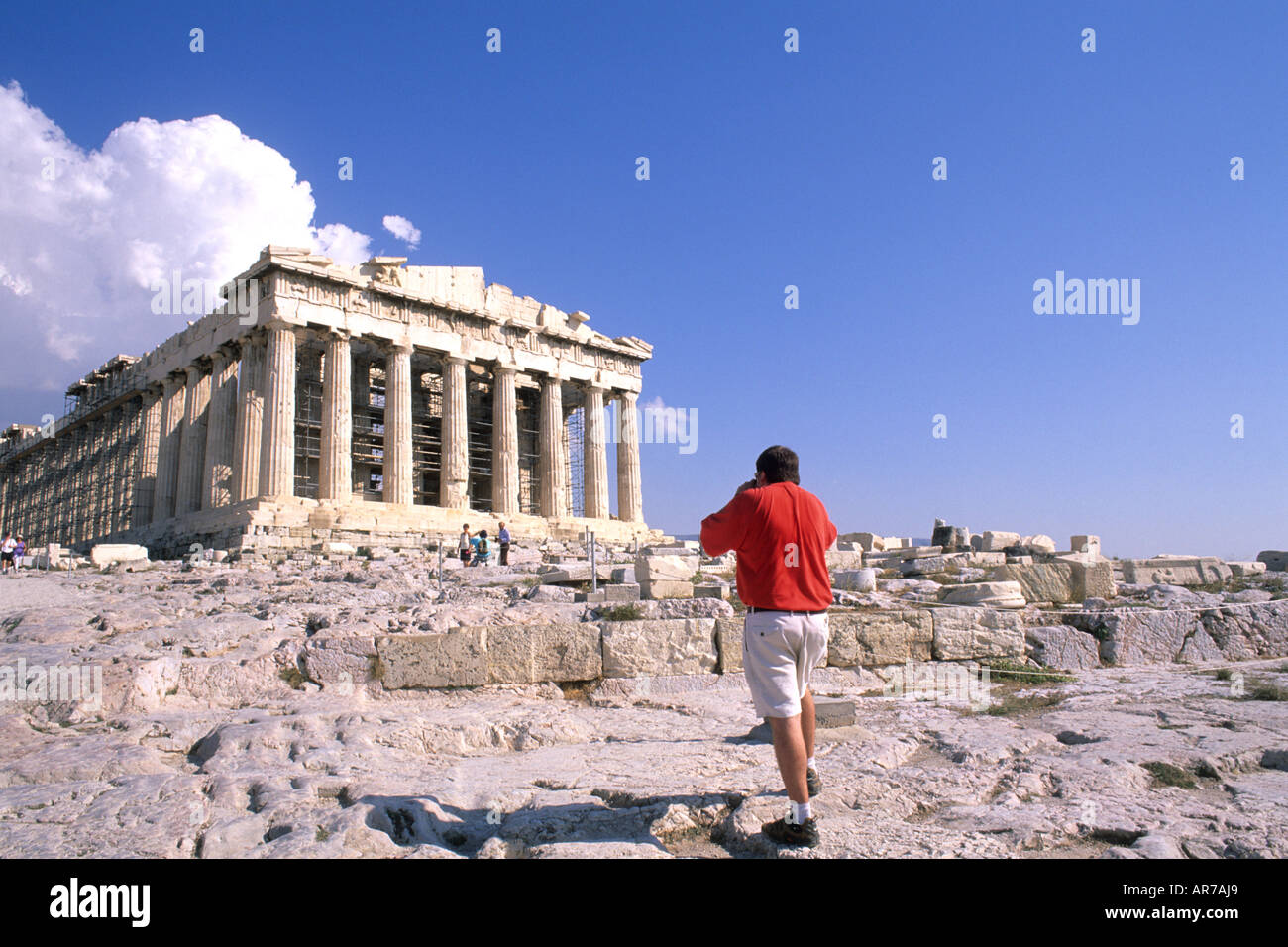 Graphic tourist in red shirt of famous world monument Acropolis ...