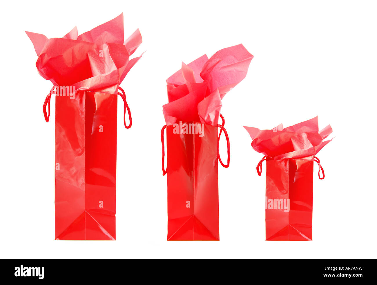 Three red shopping bags isolated on white background Stock Photo - Alamy