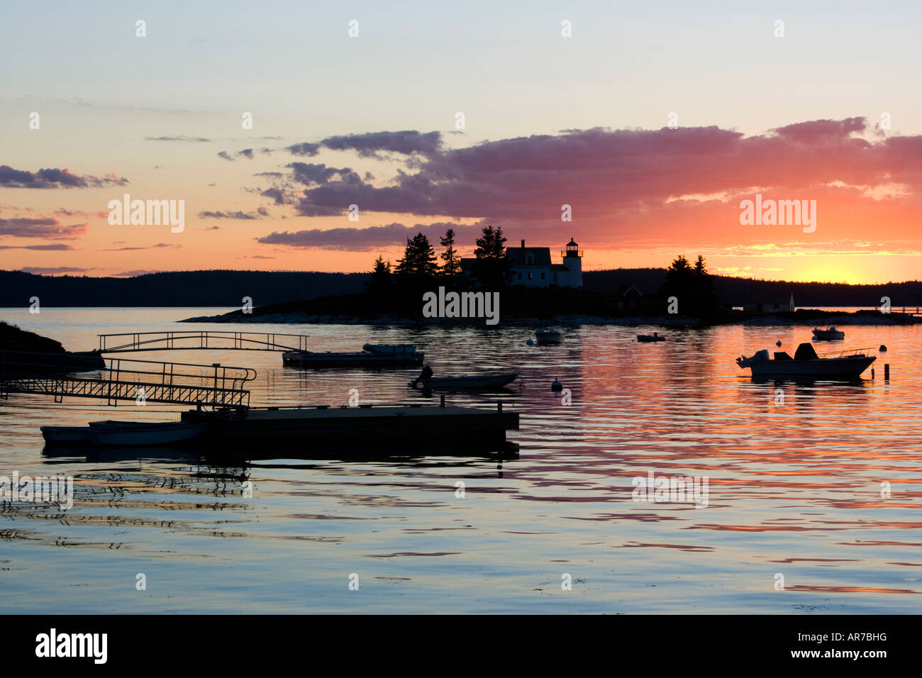 Pumpkin Island Lighthouse at sunset as seen from Little Deer Isle ...