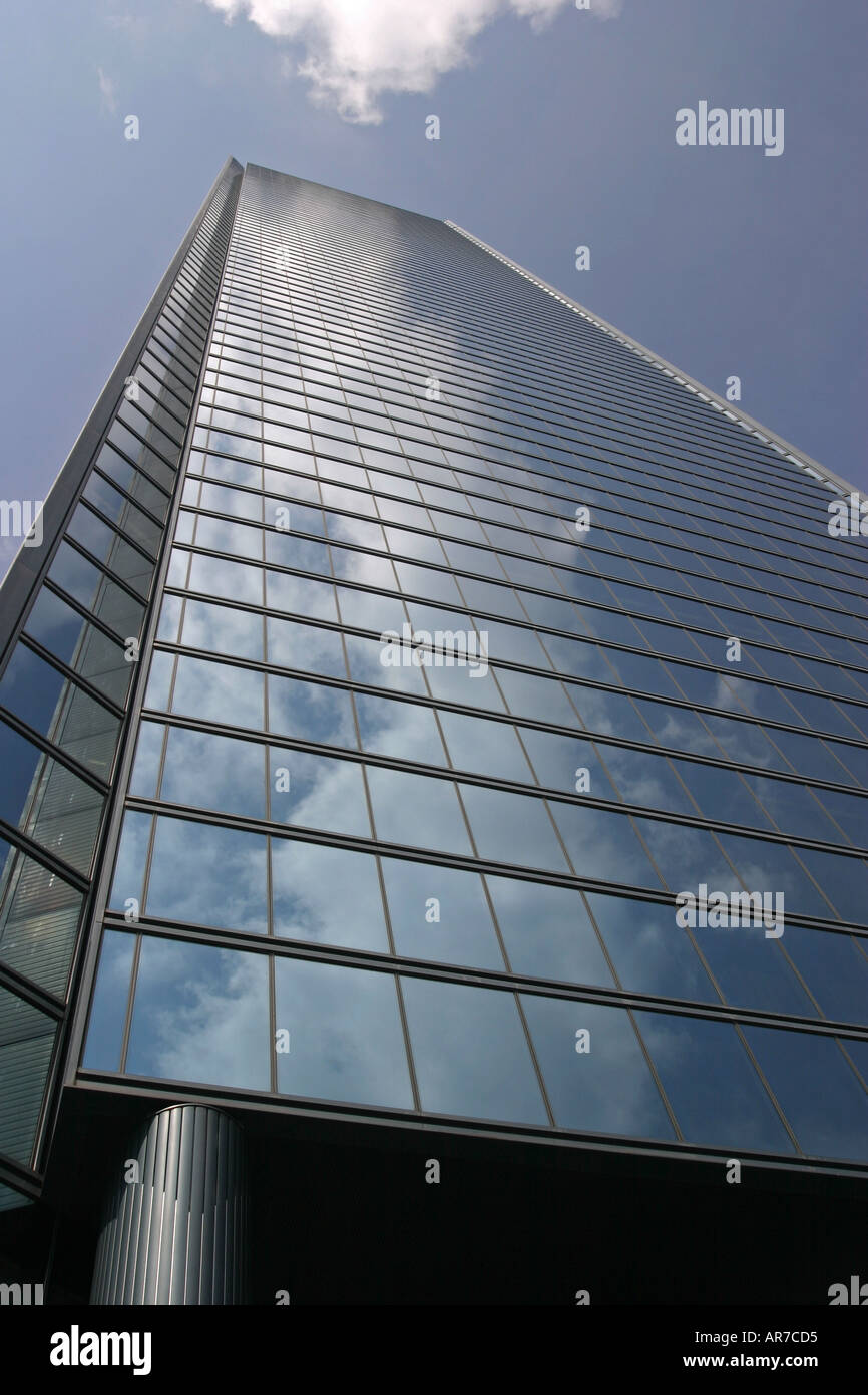 Clouds reflected in the side of a modern high rise skyscraper in Osaka ...