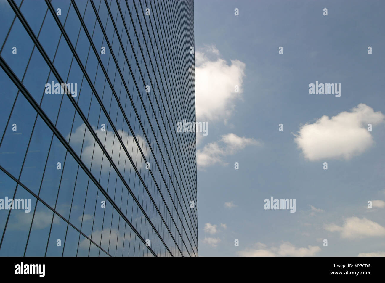 Clouds reflected in the side of a modern high rise skyscraper in Osaka ...