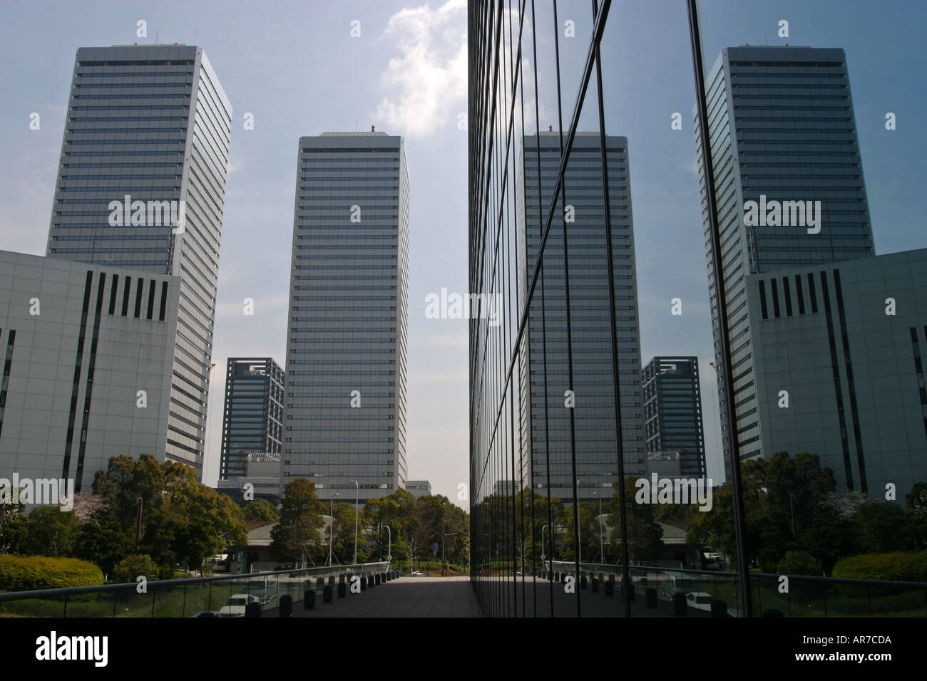 Modern high rise skyscraper buildings reflected in a modern high rise ...