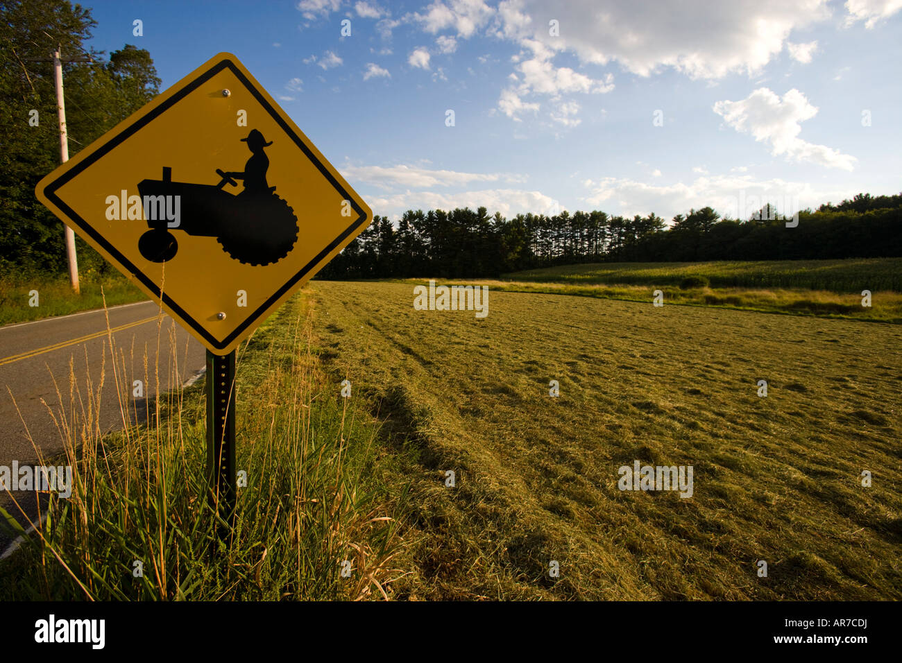 A tractor crossing sign next to a farm in Pepperell, Massachusetts ...