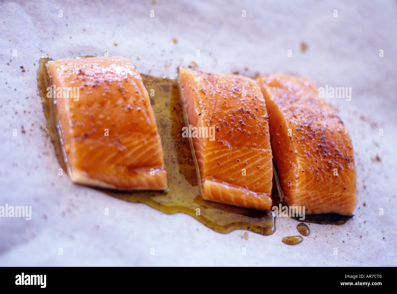 FRESH SALMON COOKED IN OLIVE OIL Stock Photo - Alamy
