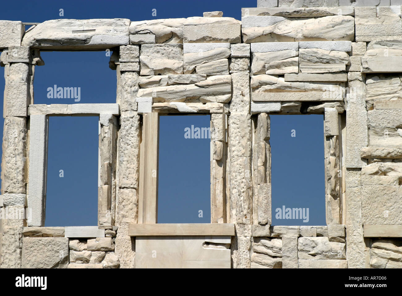 Ancient stone window frame ruins at the Acropolis Athens Greece against ...
