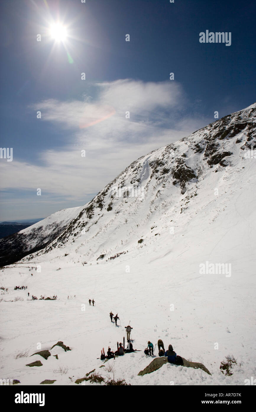 Skiers climbing Tuckerman Ravine in New Hampshire s White Mountains ...