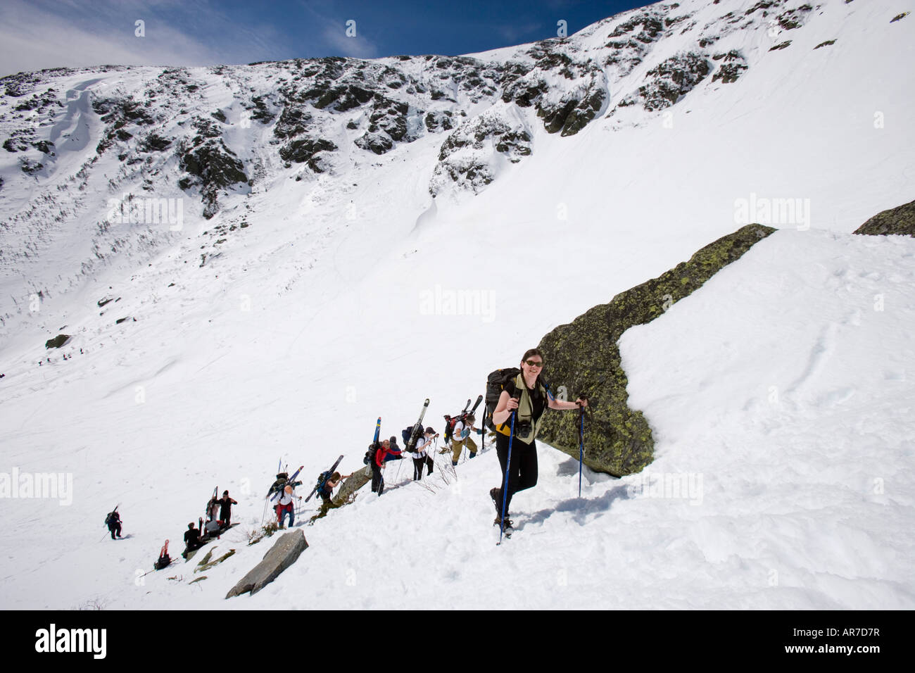 Skiers climbing Tuckerman Ravine in New Hampshire s White Mountains ...