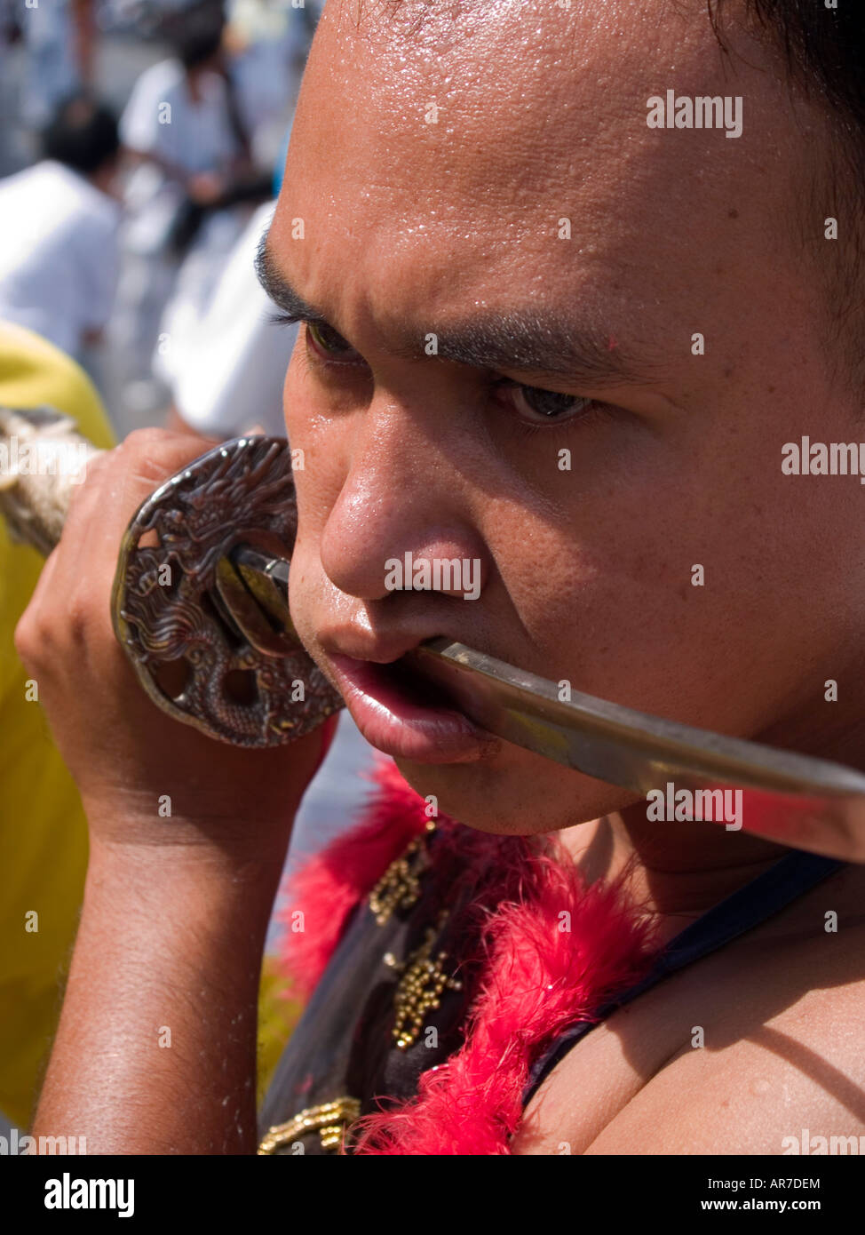 a sword through the mouth at the bizarre Vegetarian Festival Phuket ...