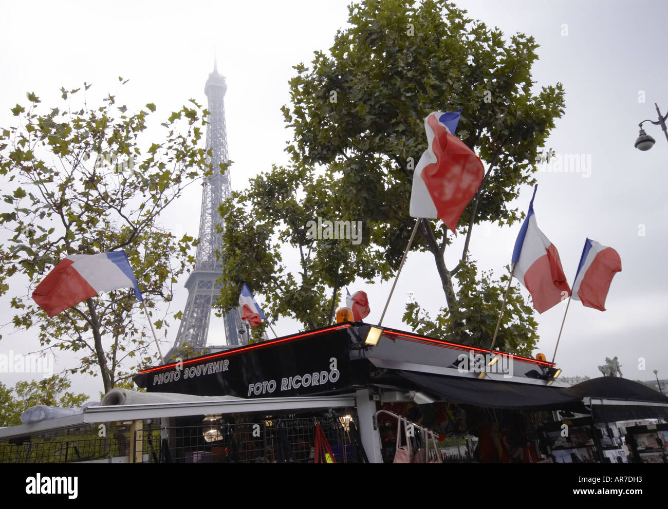 French flags on a souvenir stall in Paris and Eiffel Tower Stock Photo ...