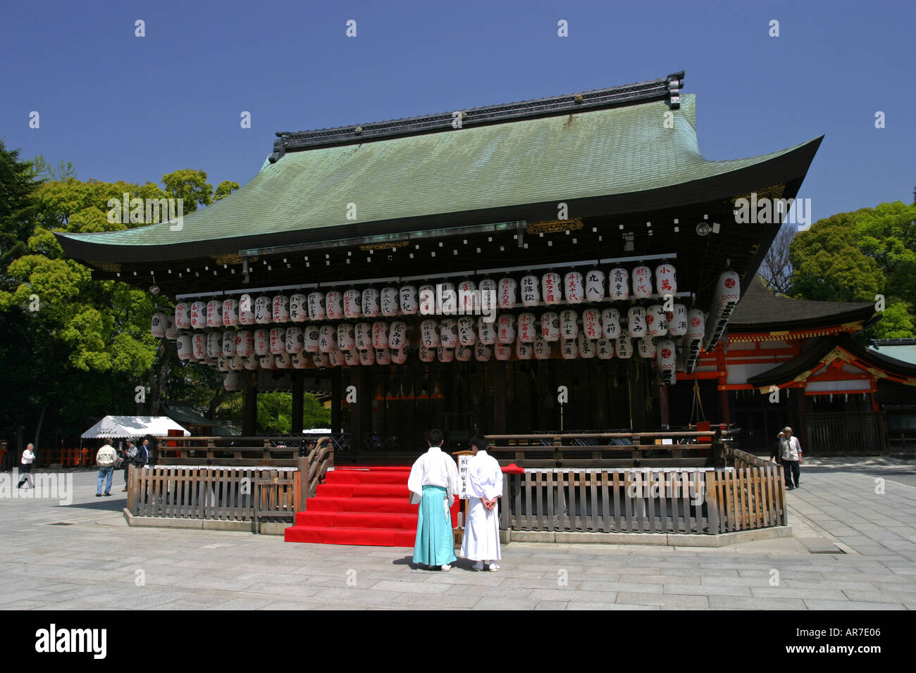 Religious shrine workers in colourful traditional costumes at Yasaka ...