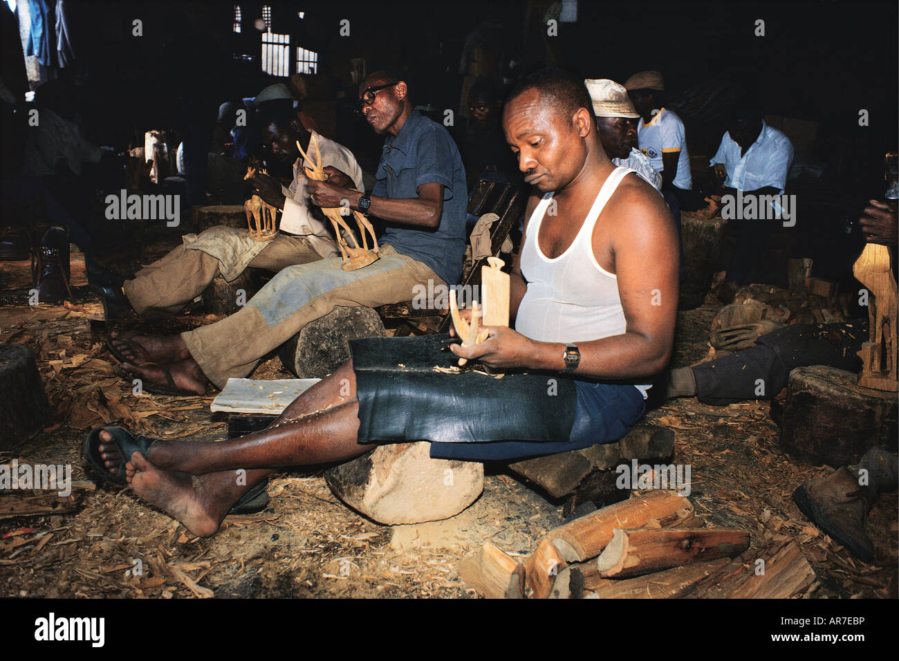 Gikamba or Kamba men woodcarvers working in a cooperative workshop ...