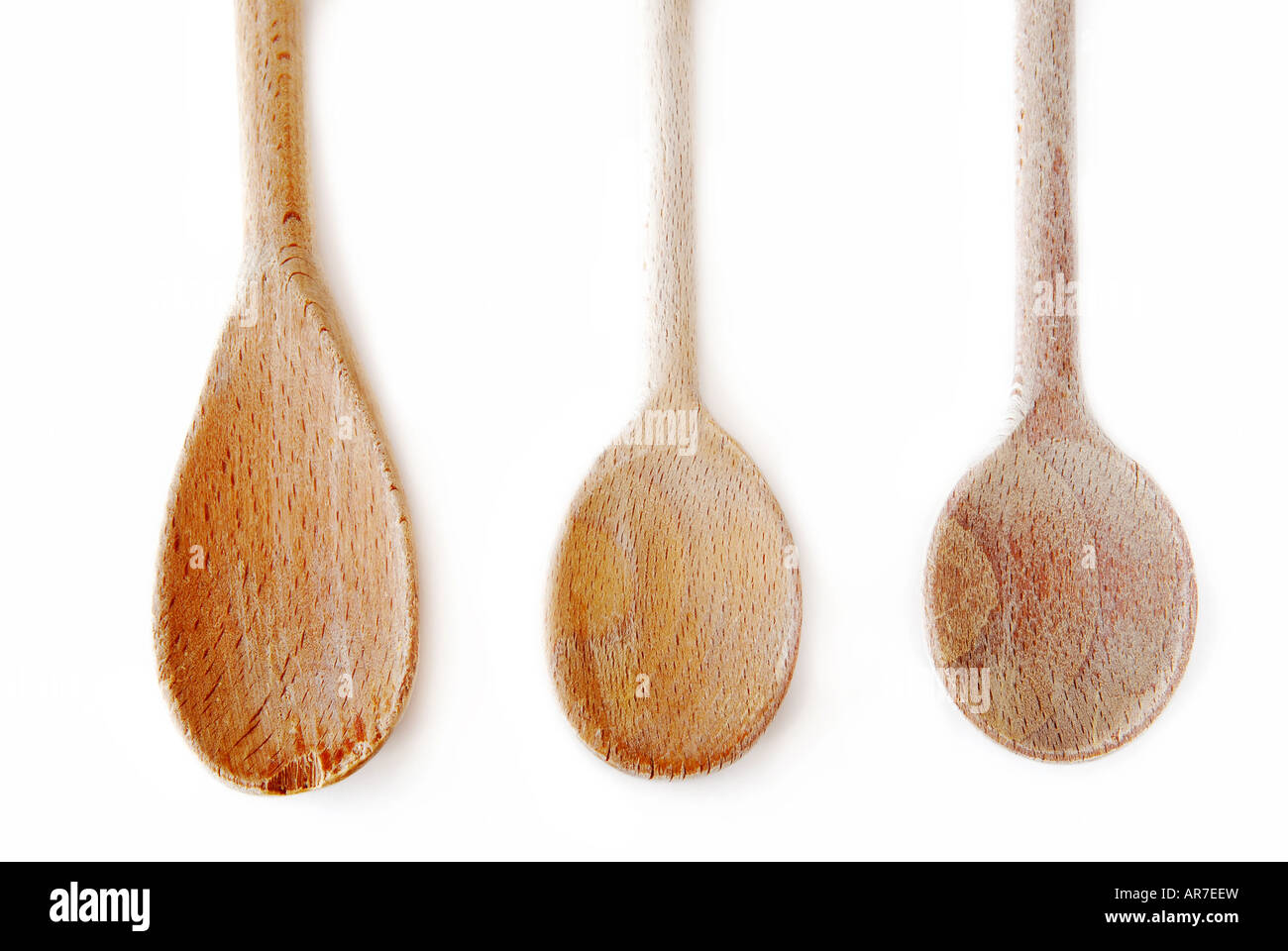 Old wooden cooking spoons isolated on white background Stock Photo - Alamy