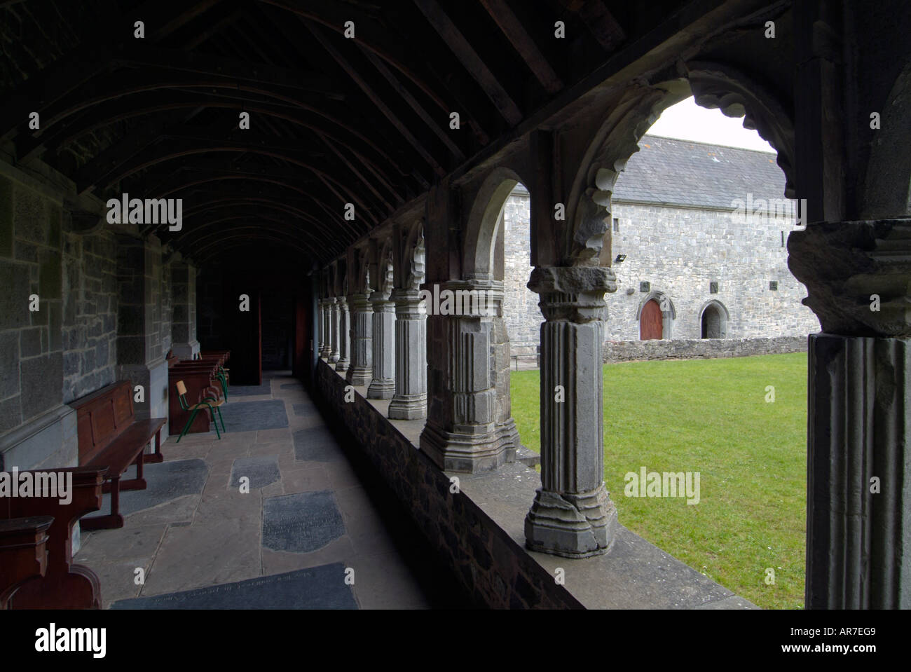 Detail of the covered walkway and cloister in Holycross Abbey ...