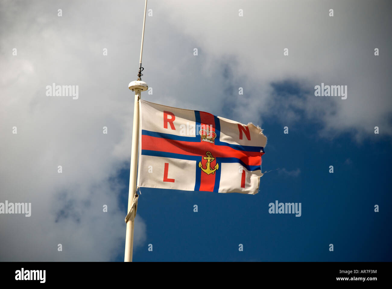 RNLI flag against sky Stock Photo - Alamy