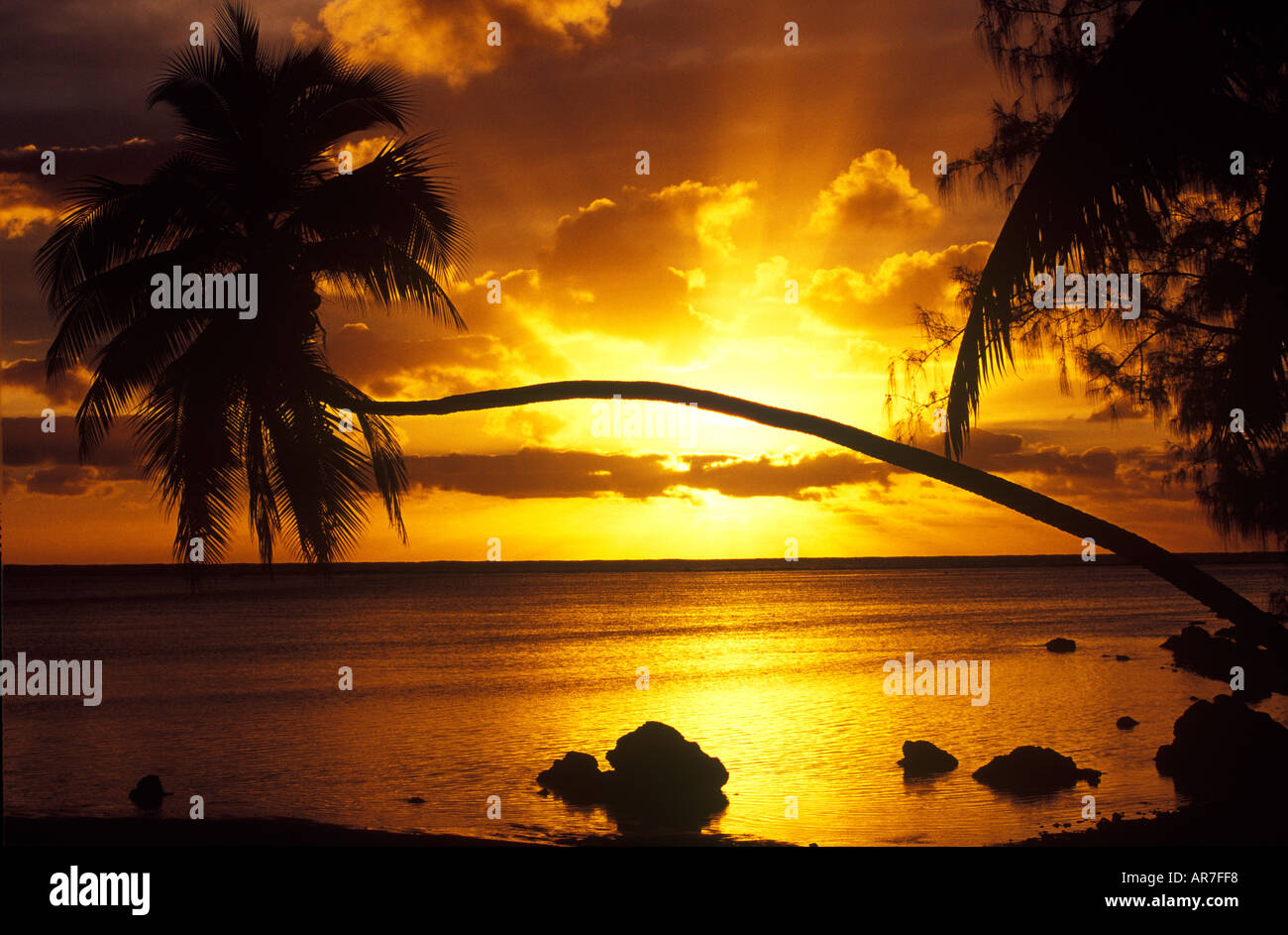 Sunset Aitutaki Cook islands Stock Photo - Alamy