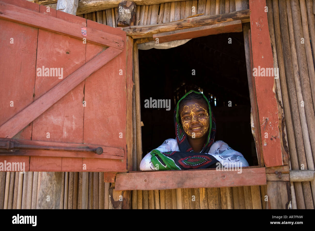 Girl with traditionally painted face from the Sakalava tribe looking ...