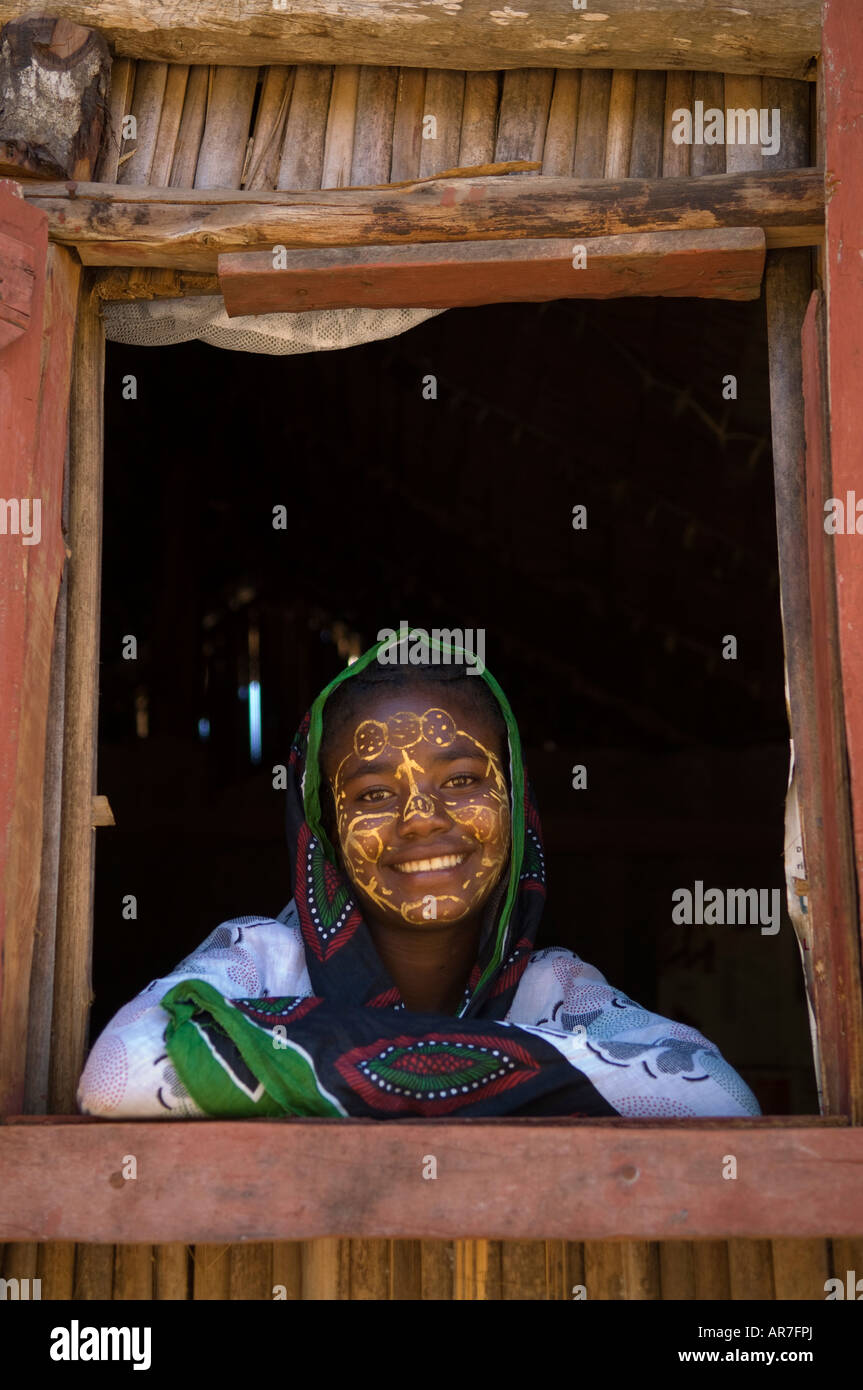 Girl with traditionally painted face from the Sakalava tribe looking ...