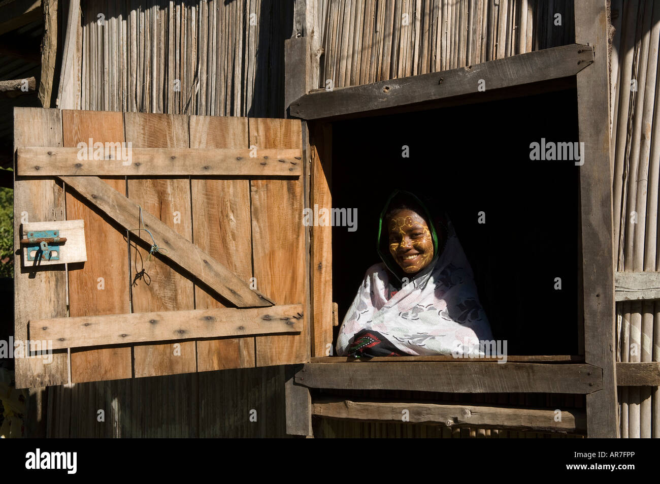 Girl with traditionally painted face from the Sakalava tribe looking ...