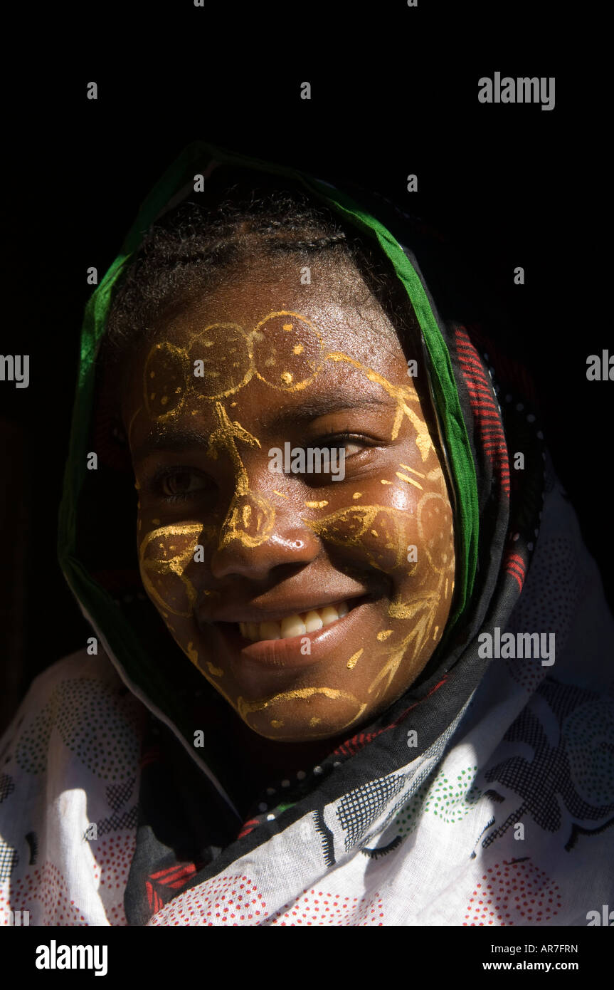 Girl with traditionally painted face from the Sakalava tribe, Nosy Be ...