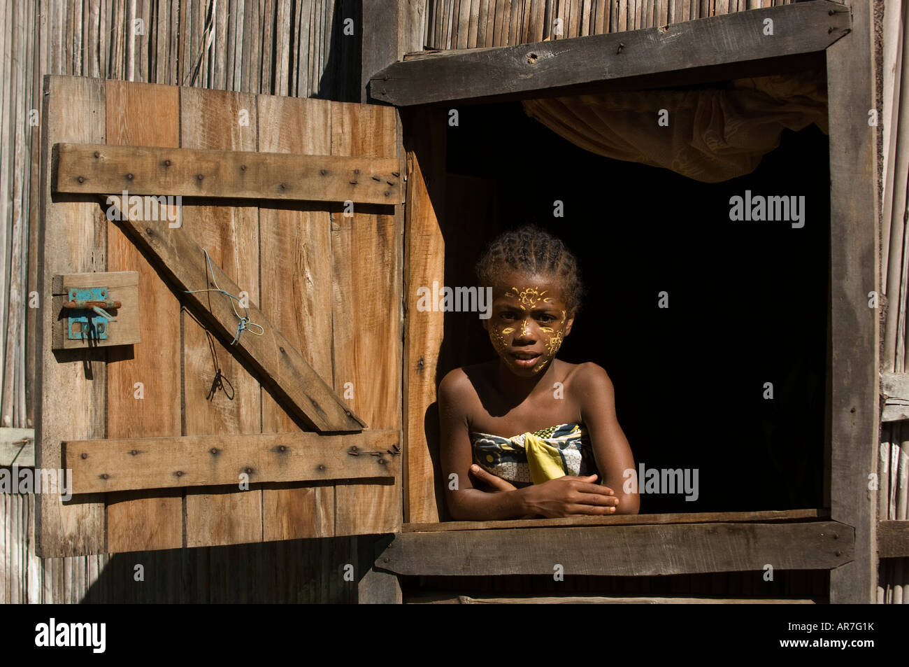 Girl with traditionally painted face from the Sakalava tribe looking ...