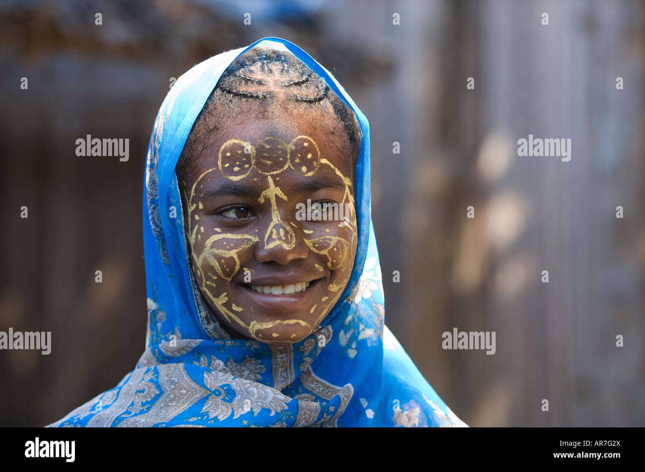 Girl with traditionally painted face from the Sakalava tribe, Nosy Be ...