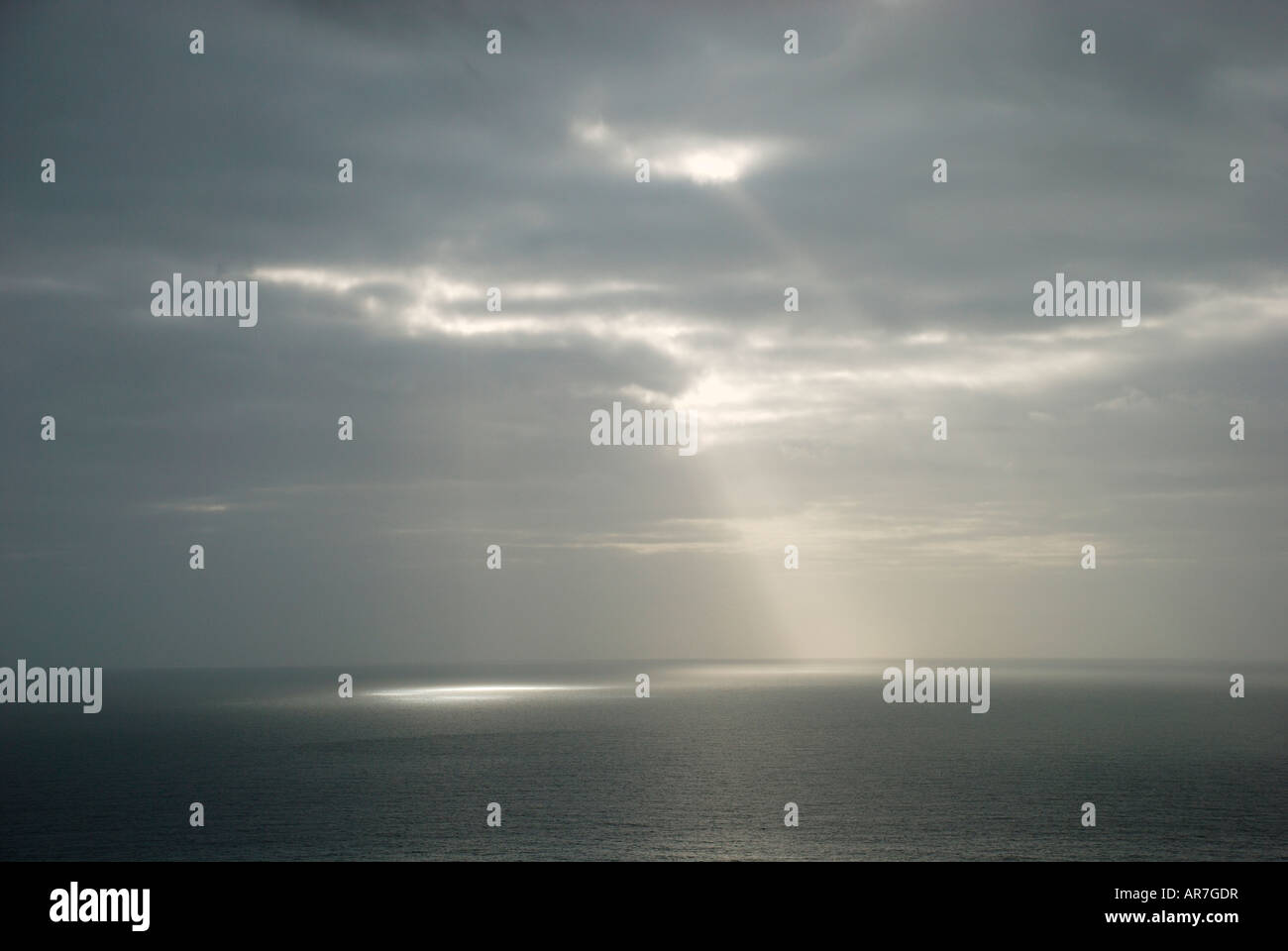 rays of sun through clouds over the sea Stock Photo - Alamy
