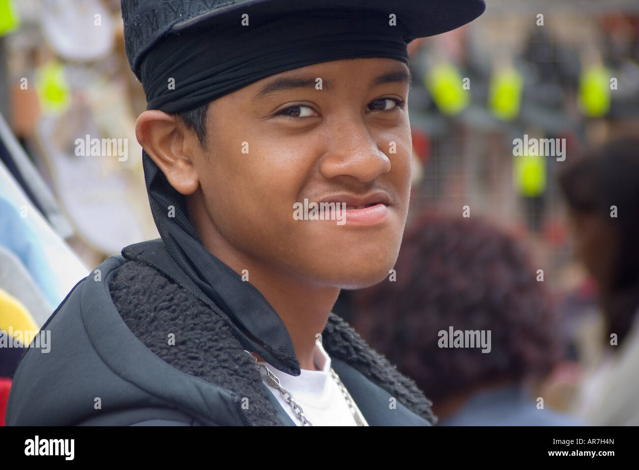 Boy with grin on his face outdoors in the public Stock Photo - Alamy