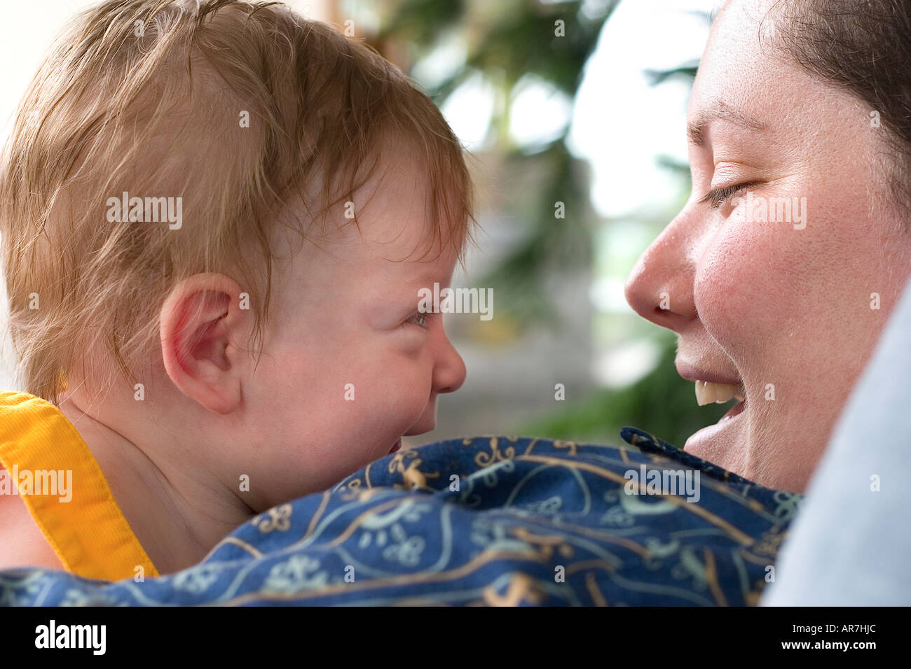 Mother Laughing with Baby Stock Photo - Alamy