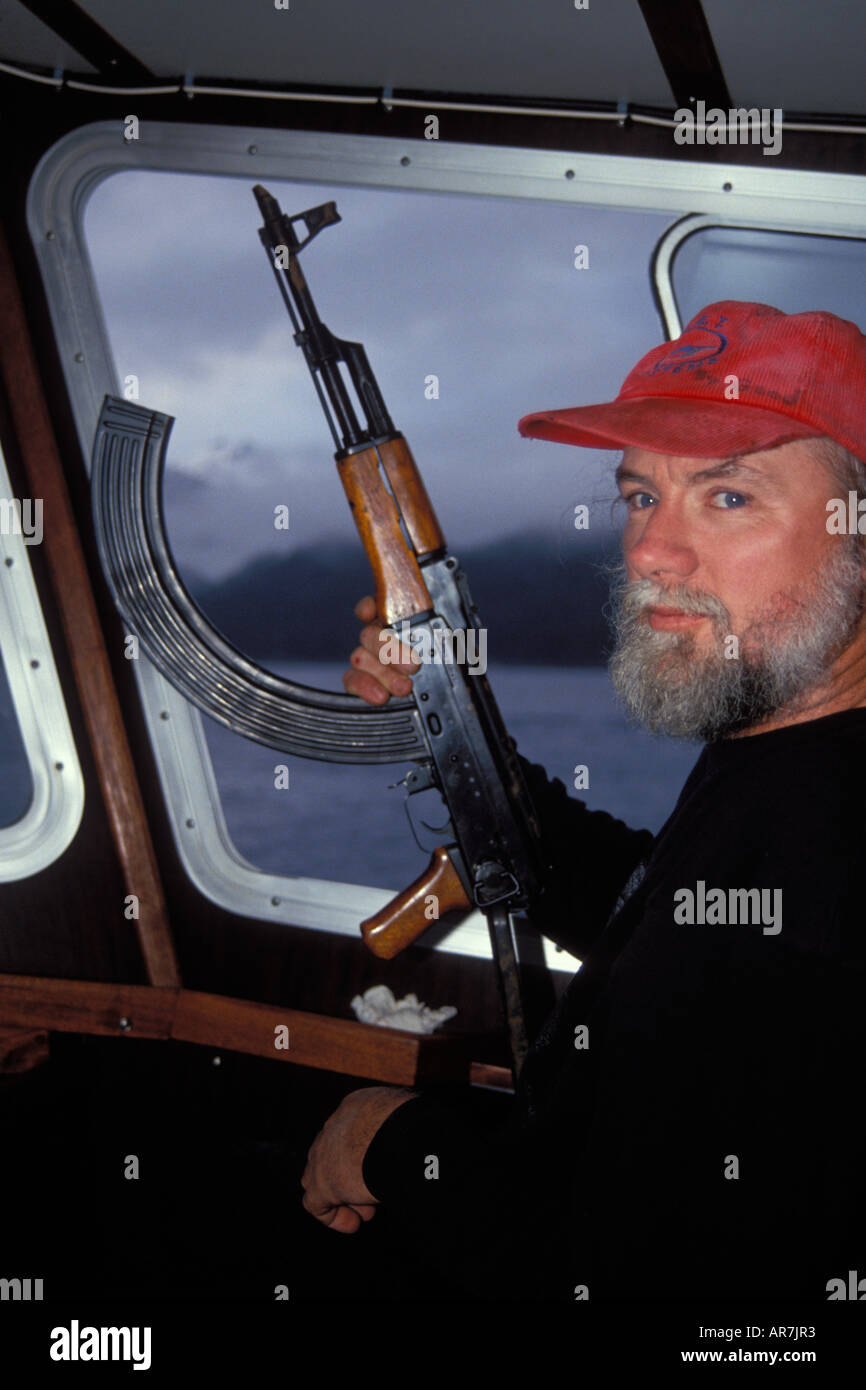 salmon fisherman displays his AK47 weapon southeast Alaska Stock Photo ...