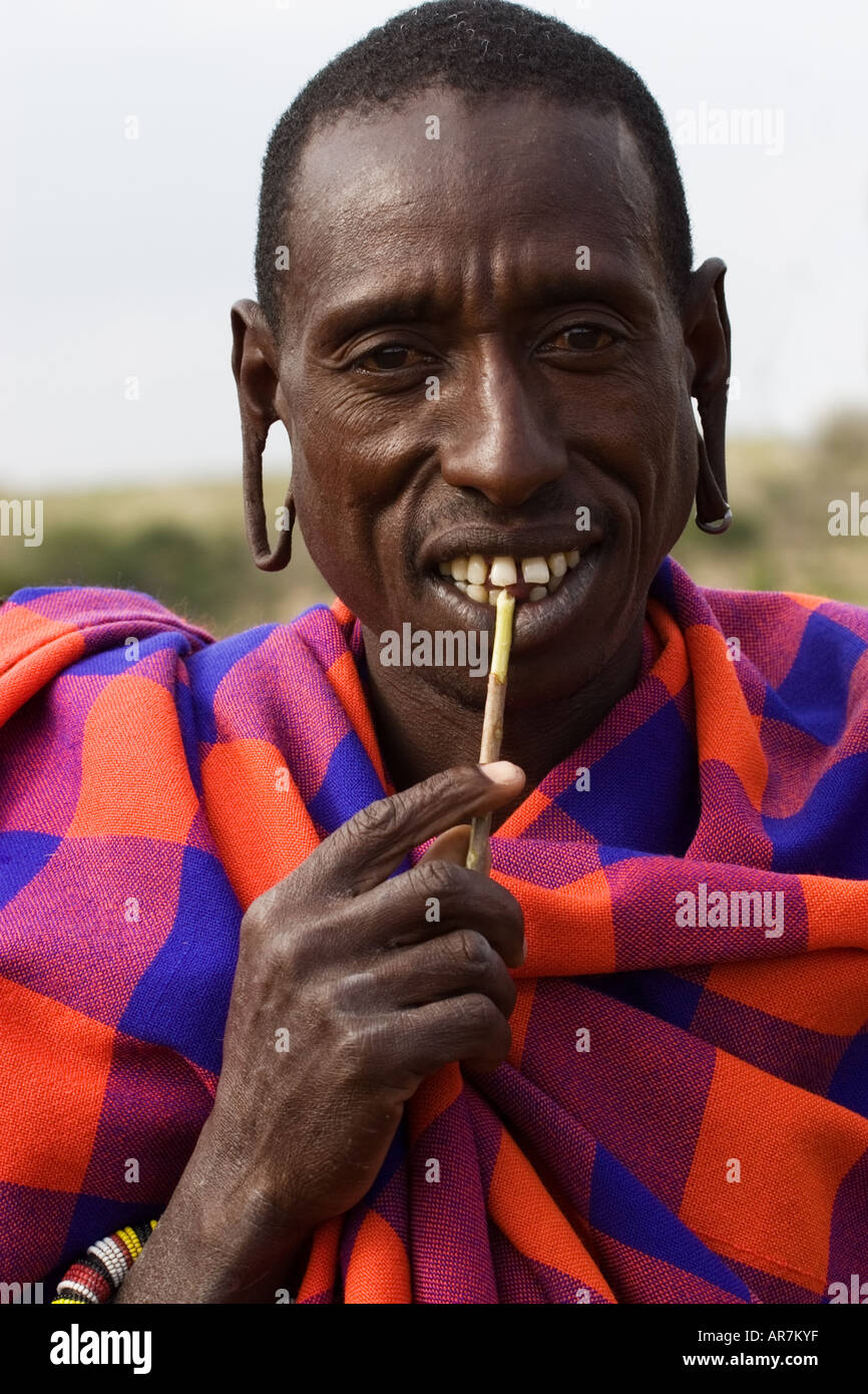 Portrait of Maasai man wearing trraditional cloak and decorations ...