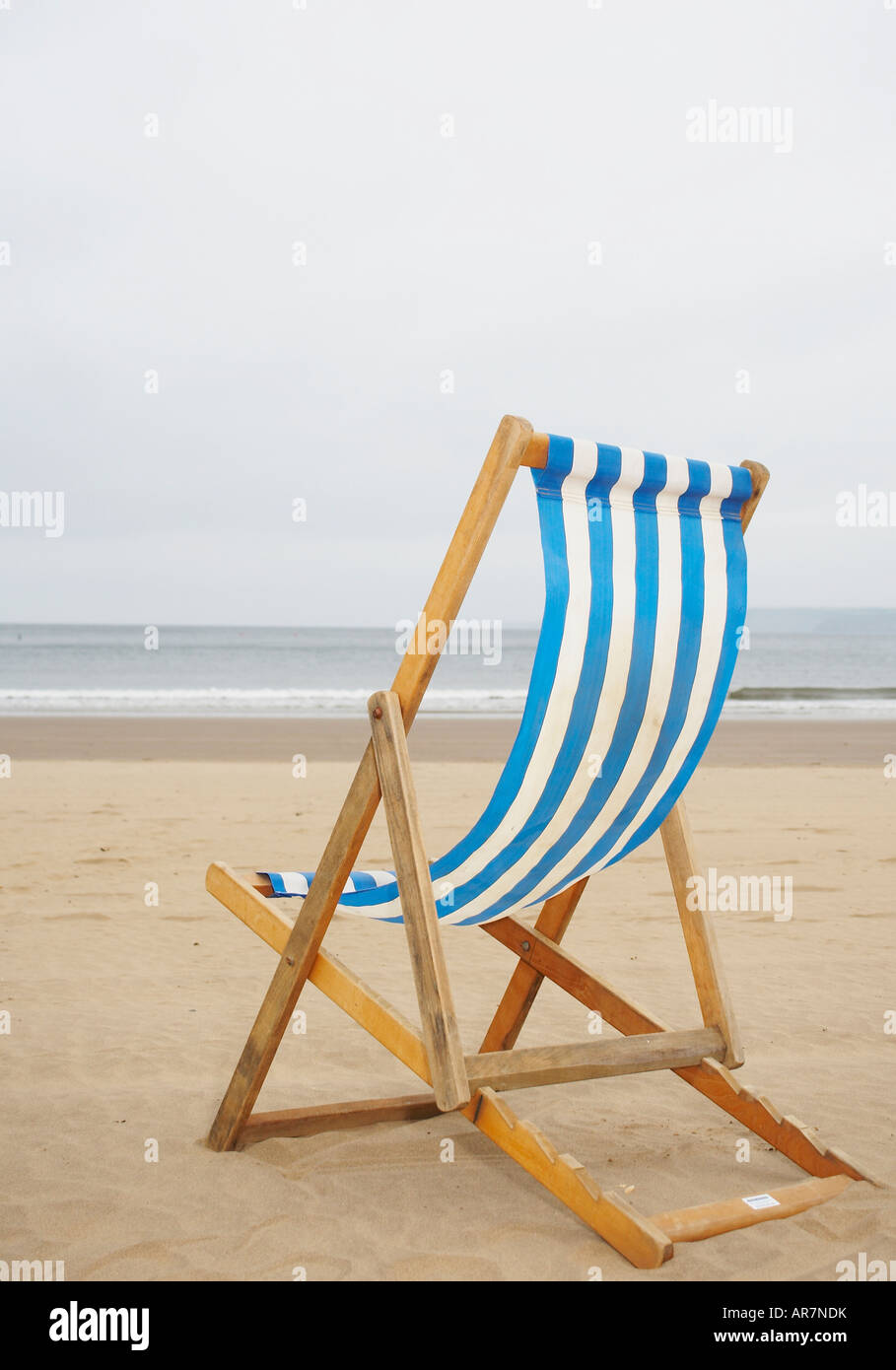 Deckchair on the beach Stock Photo - Alamy