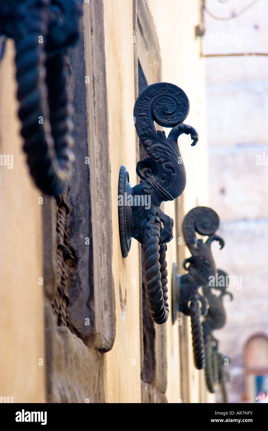 Row of iron rings in a Palazzo wall Siena Italy Stock Photo - Alamy