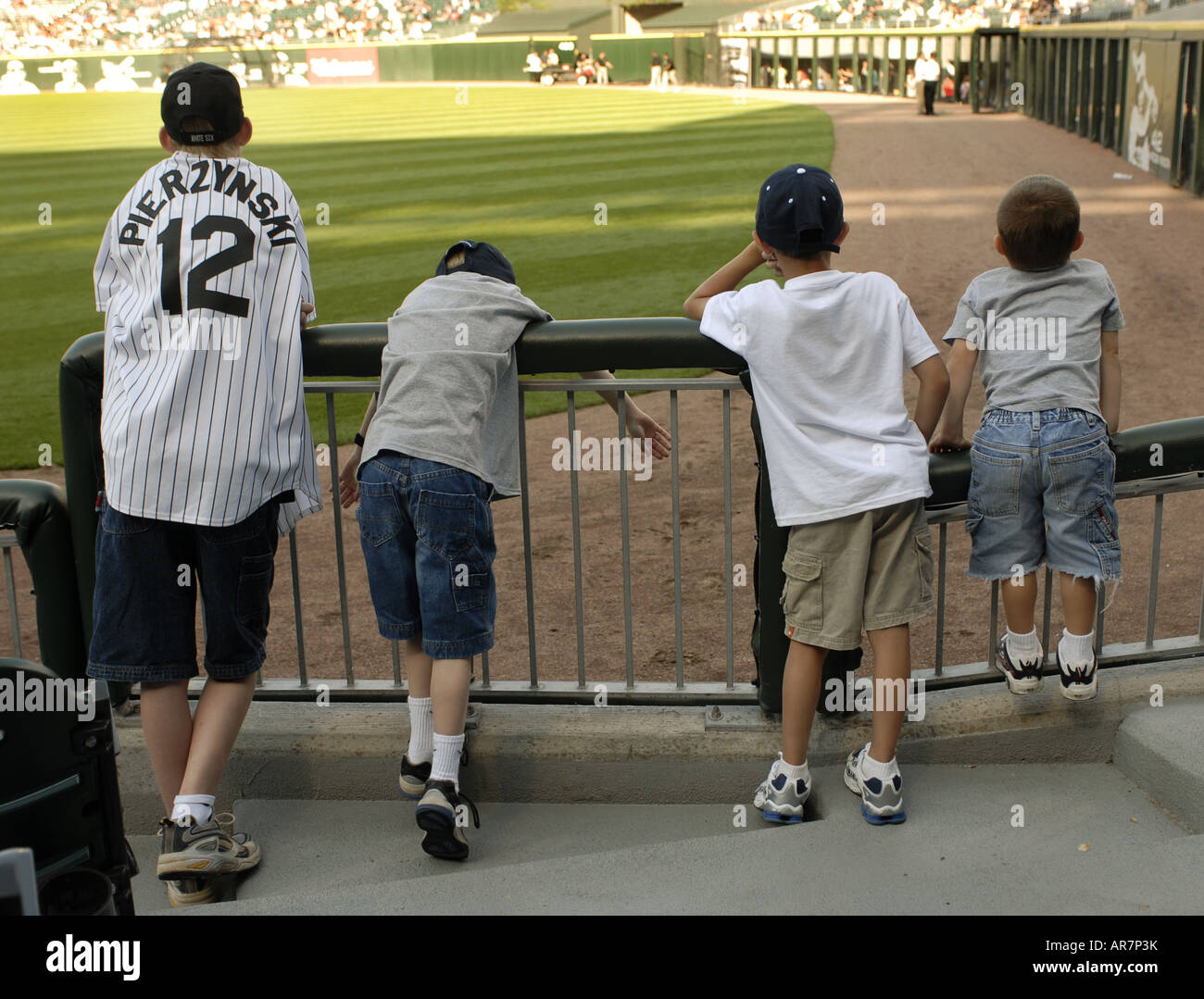 Young fans wait for the start of a baseball game Stock Photo - Alamy