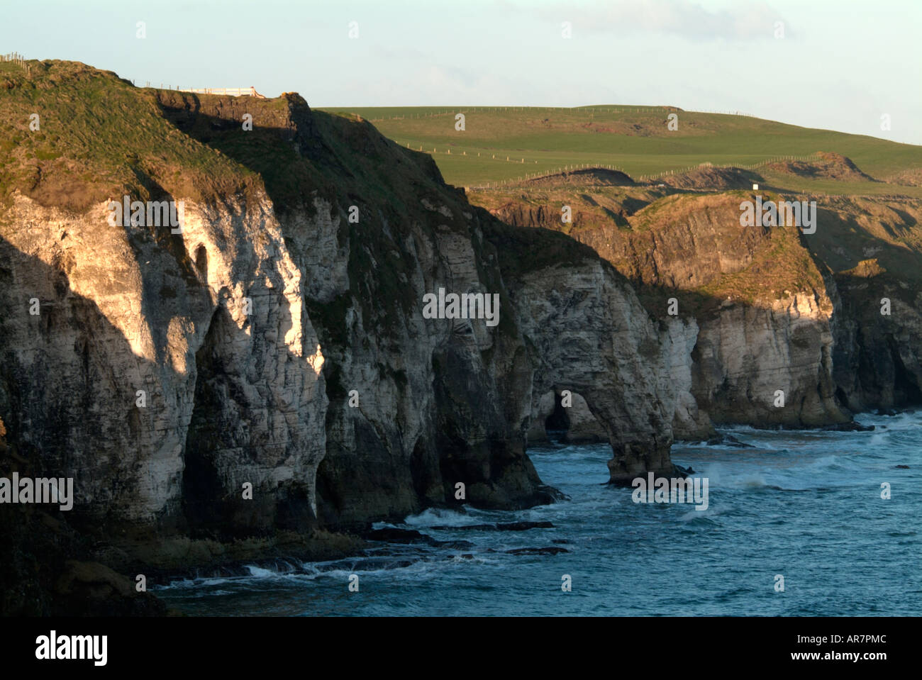 Horizontal view of sea arch along the causeway coast County Antrim ...