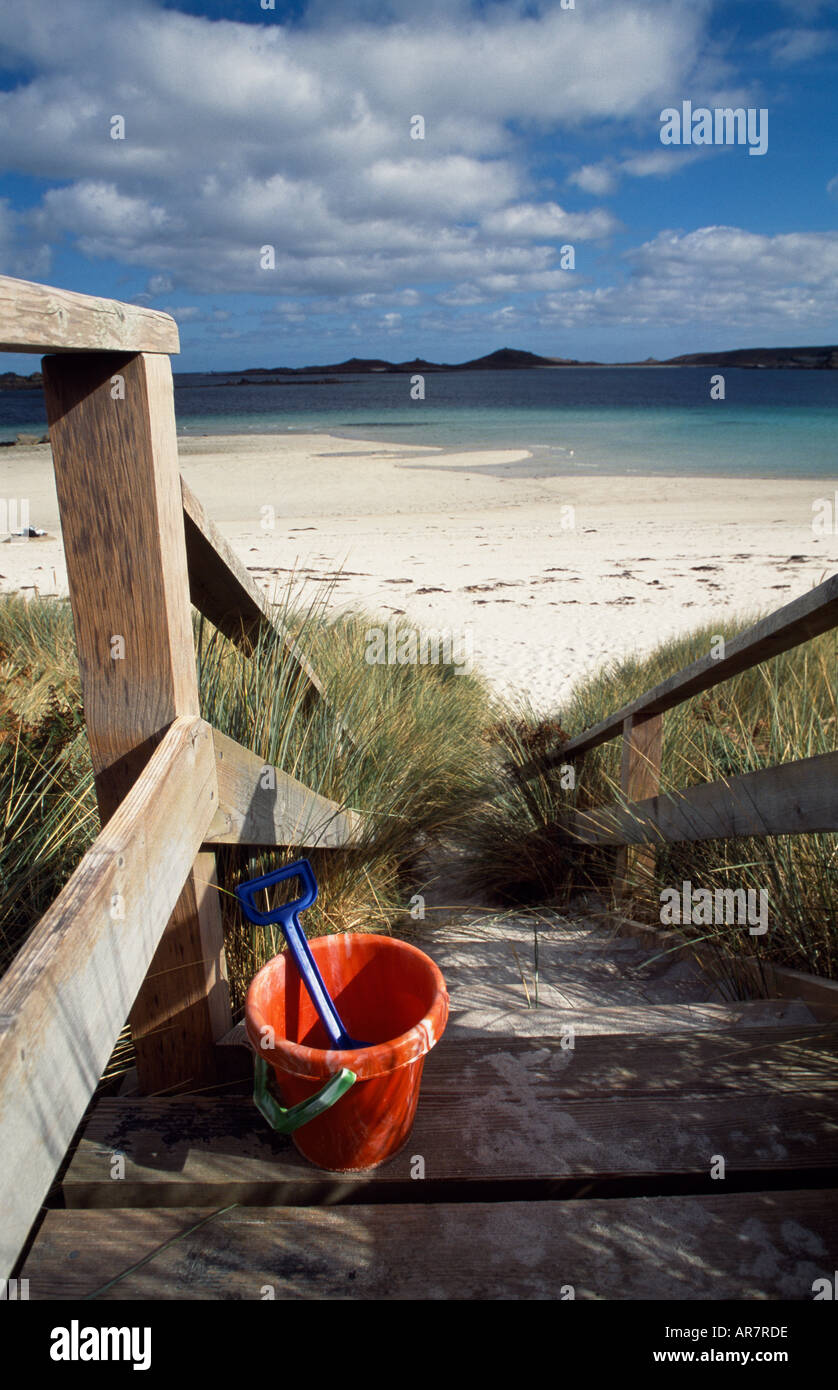 A bucket and spade on the steps leading to the beach near Blockhouse ...