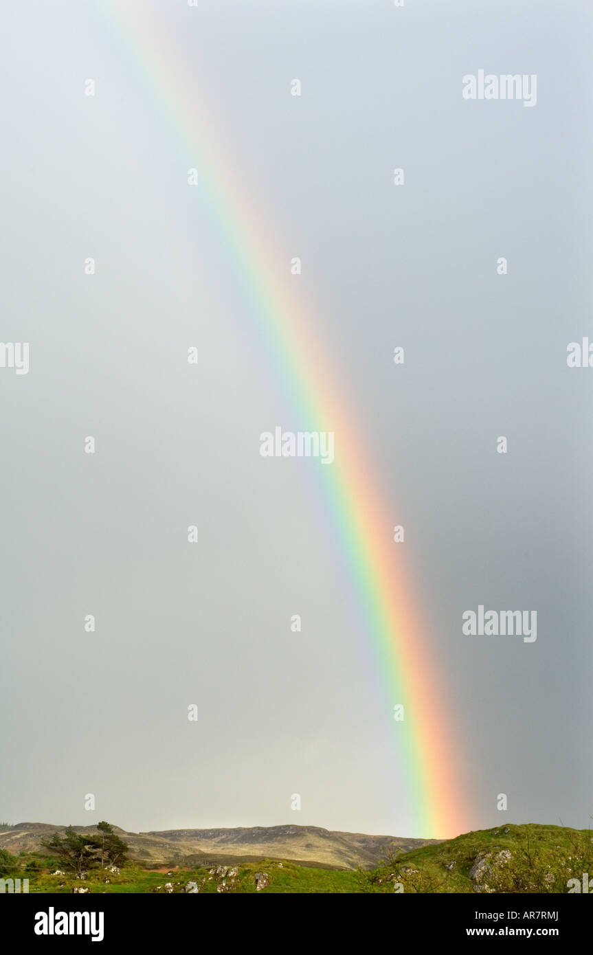 Rainbow over the Scottish highlands splits the colour of the sky in two ...
