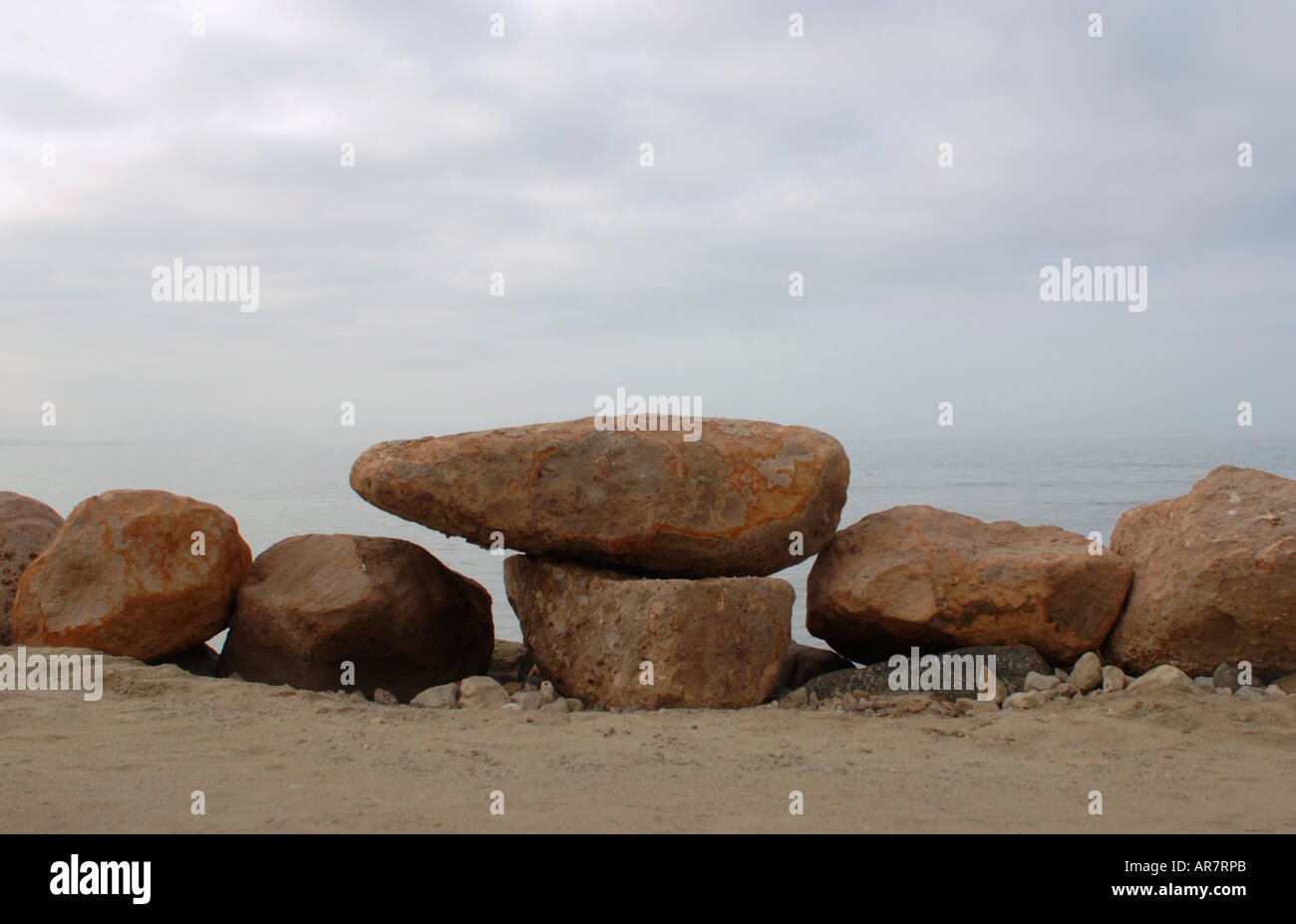 Stones on a Jetty With a Cloudy Steel Blue Backdrop form graphic art ...