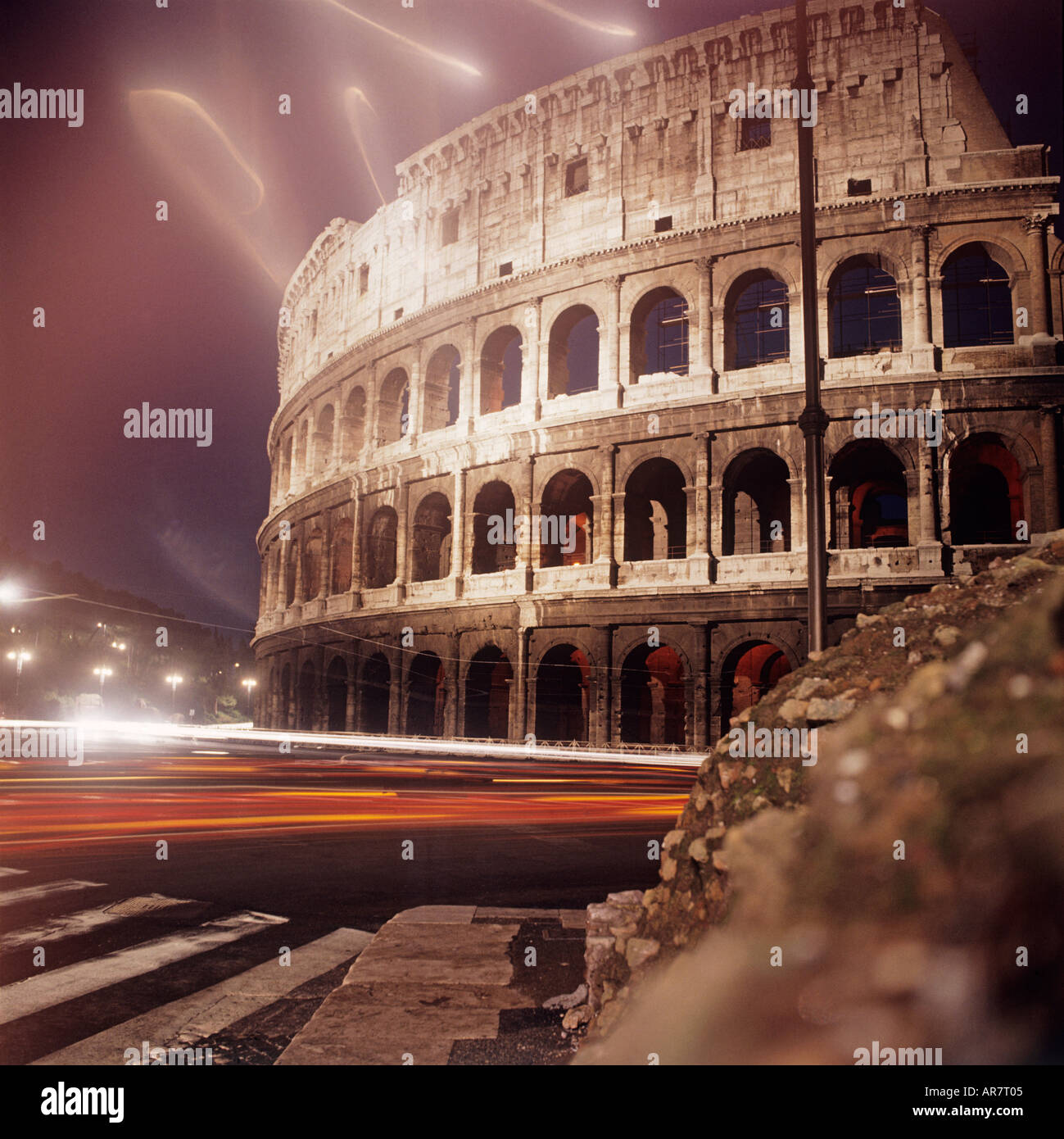 Italy. The coluseum Rome.Traffic zooms past the Coliseum by night Stock ...