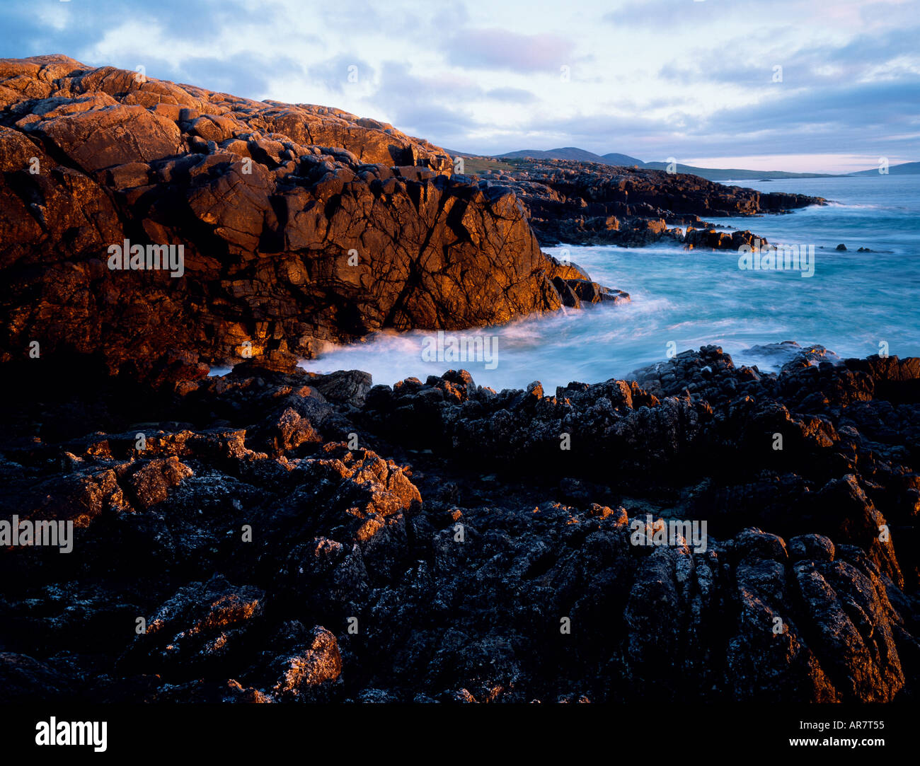 Evening light on rocks Stock Photo - Alamy