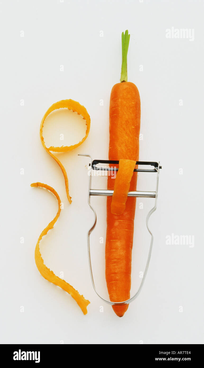 Swivel bladed peeler with carrot and shaved strips Stock Photo - Alamy