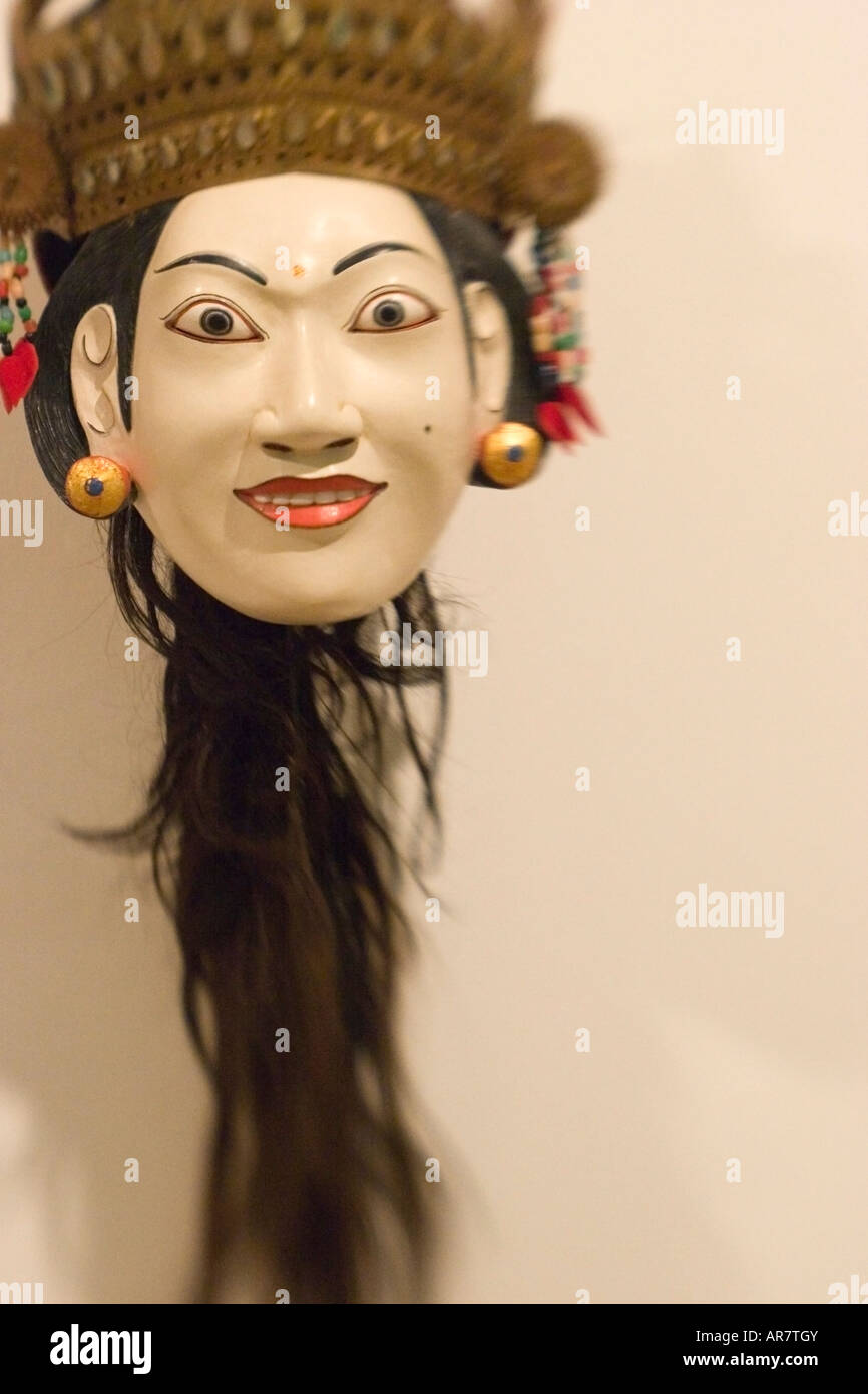 A traditional carved wooden mask from the island of Java, in Indonesia ...